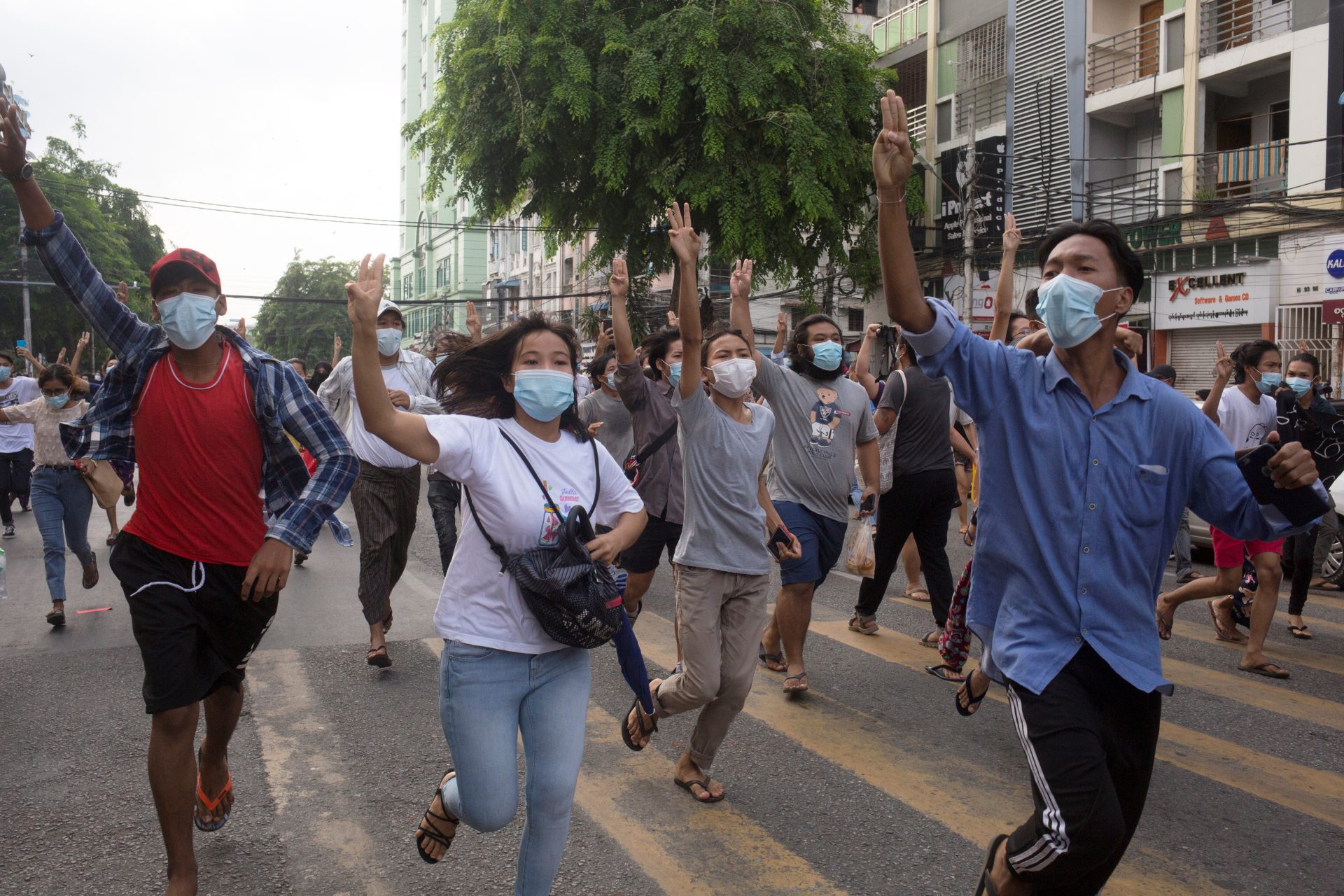 Hundreds of Myanmar activists hold flash mob protest against military ...