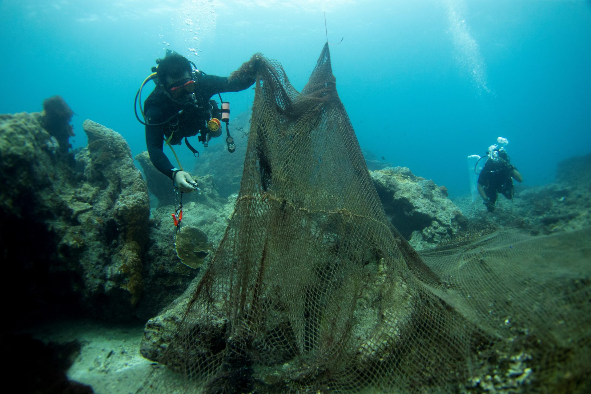 Thai divers remove fishing nets bleaching protected coral reefs - LiCAS ...